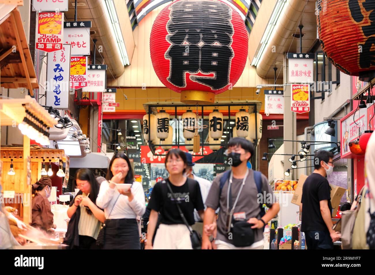 Foreign tourists visit at Kuromon Market (Kuromon Ichiba Fish Market ...