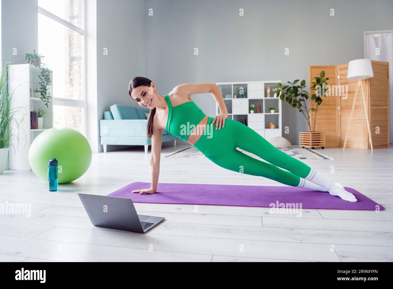 Full length photo of sportive great shape person watch video netbook ...