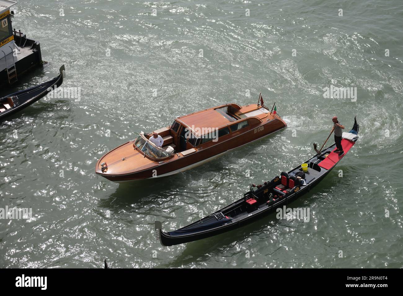A luxury taxi and a gondola waiting for guests at the Monaco hotel in ...