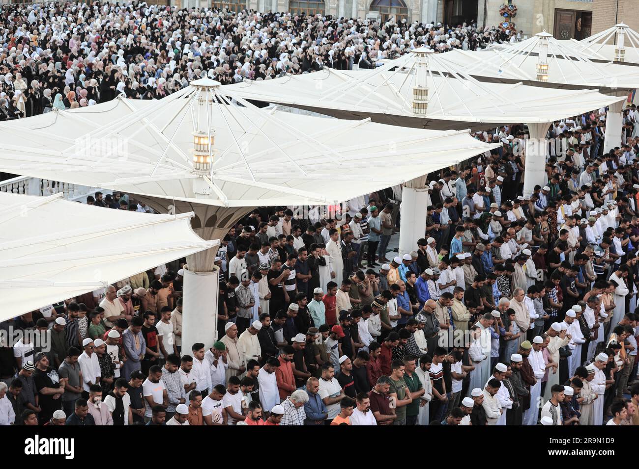 Baghdad, Iraq. 28th June, 2023. Muslims perform Eid al-Adha prayers at ...