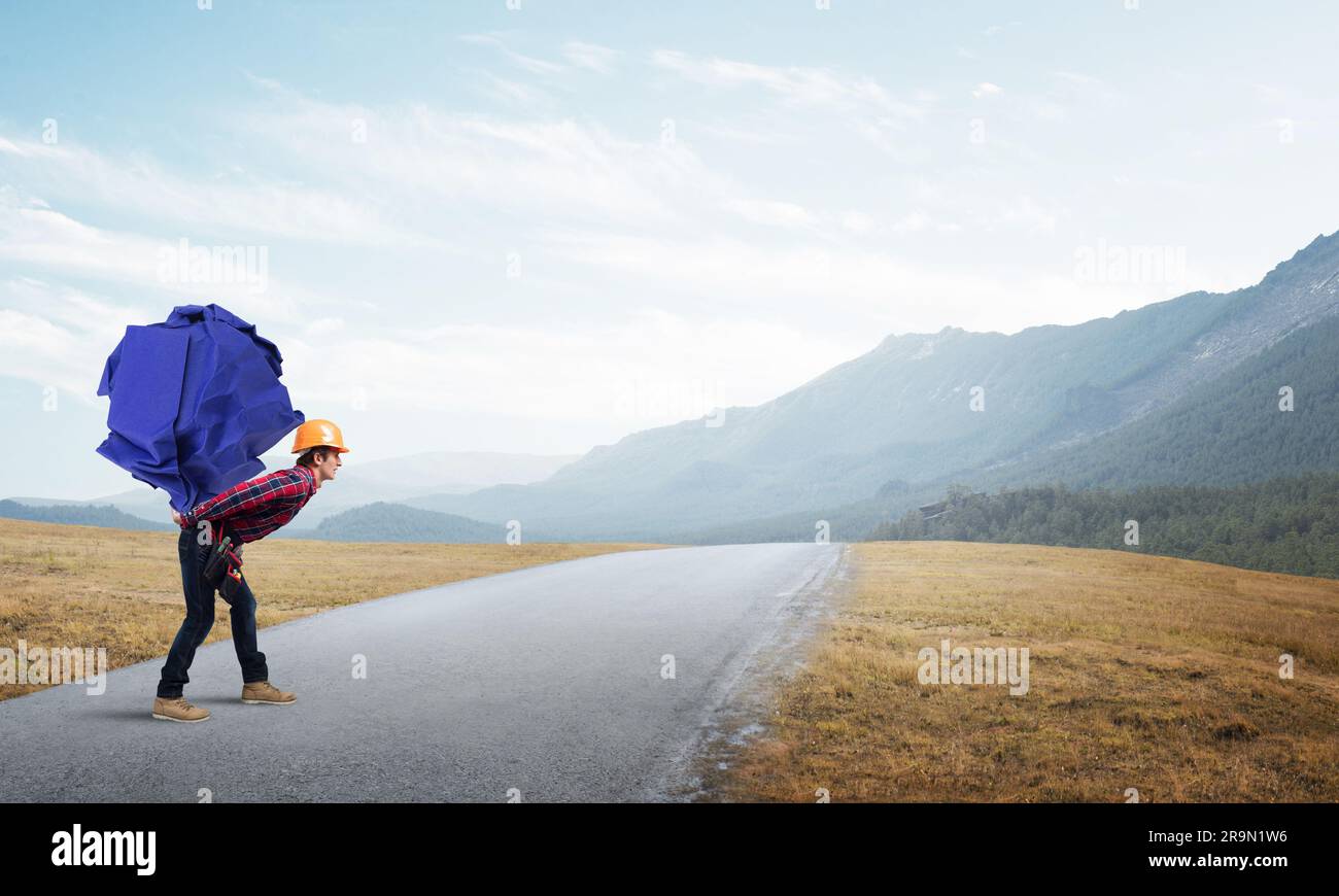 Engineer man carry load Stock Photo - Alamy