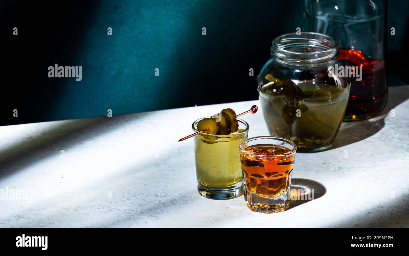 Pickleback, alcoholic cocktail drink from cucumber pickle and whiskey ...