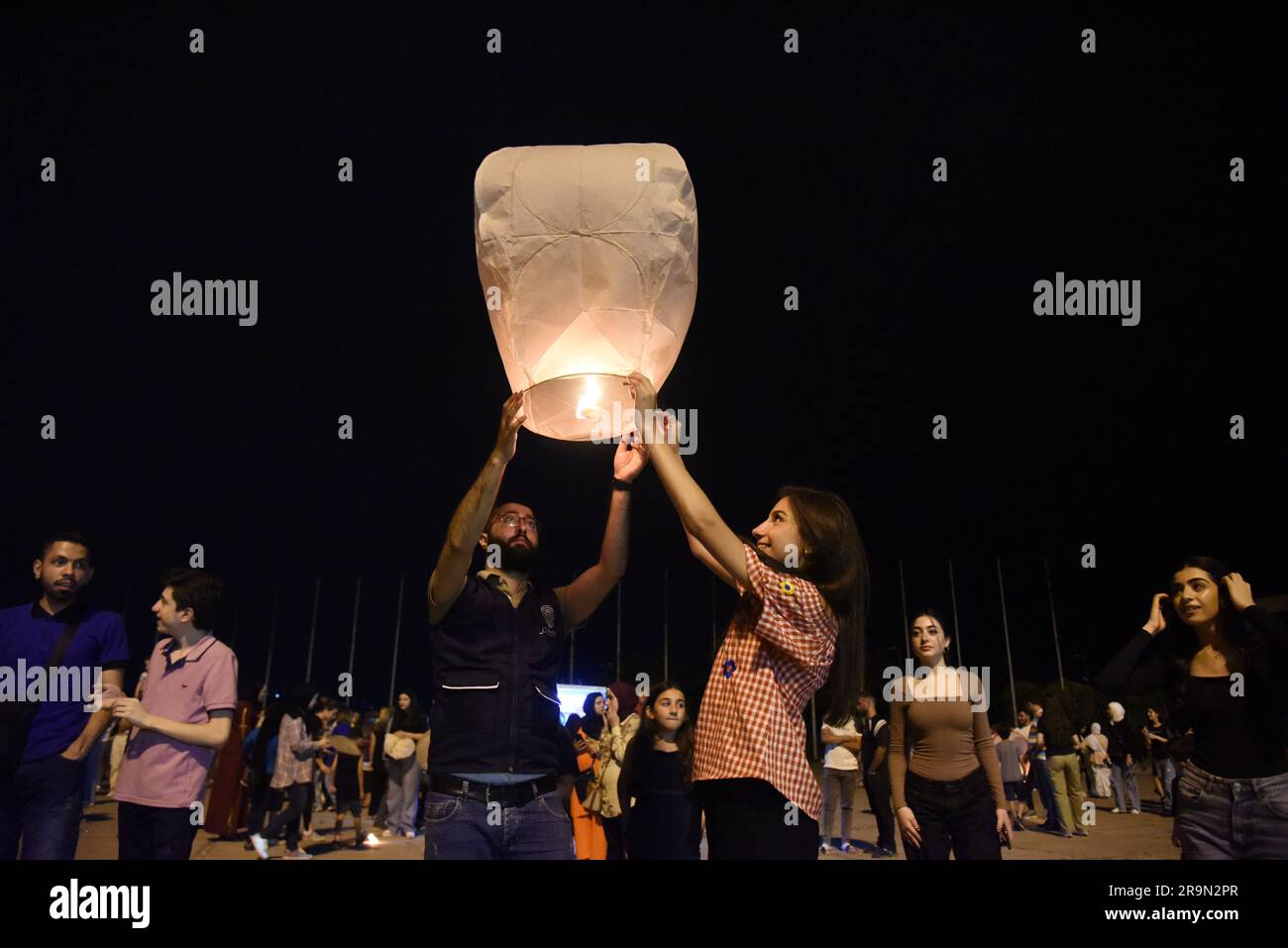 Tripoli, Lebanon. 27th June, 2023. People release a sky lantern to ...