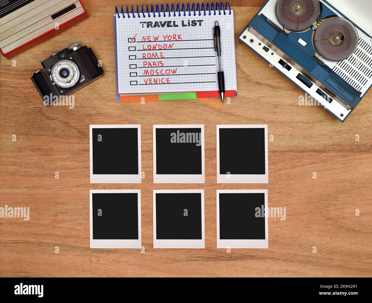 Old retro reel tape recorder, vintage radio, retro camera on wooden ...