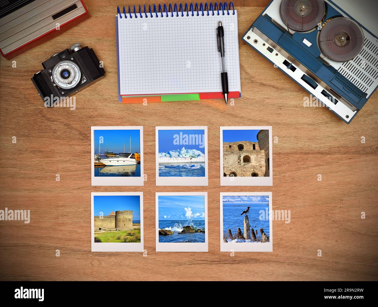 Old retro reel tape recorder, vintage radio, retro camera on wooden ...