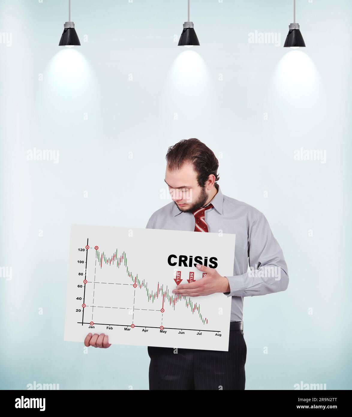 businessman holding poster with drawing crisis chart Stock Photo - Alamy