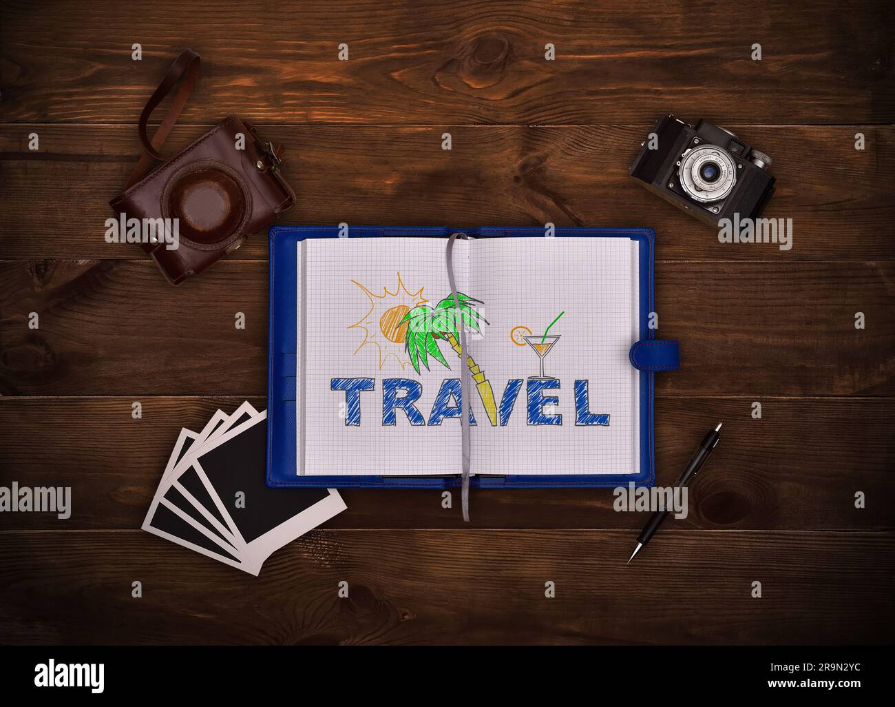 Camera, pen and note pad with drawing travel concept. Work desk tourist ...