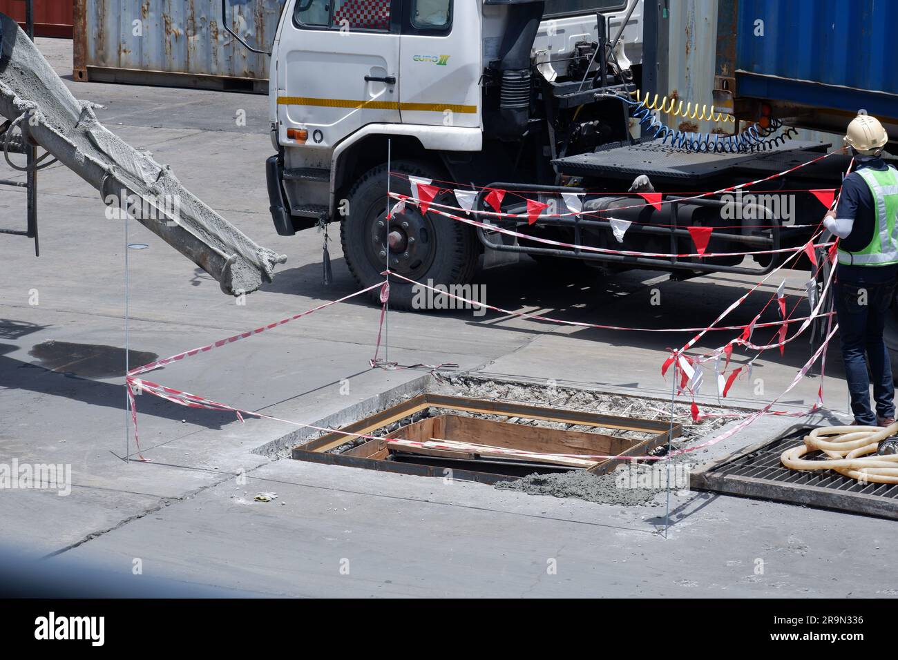 repairing the road construction corner Stock Photo - Alamy