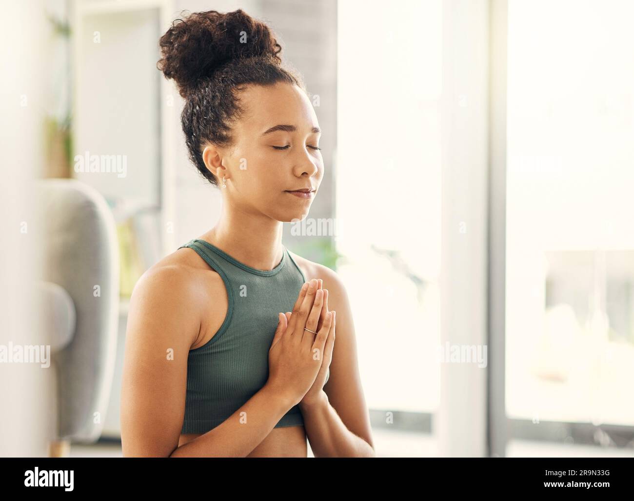 Praying hands, relax and meditation by woman in a living room for peace ...