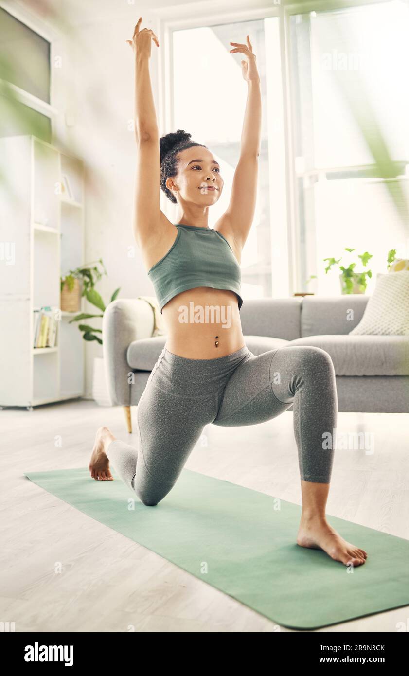 Yoga, lunge and woman at home with zen, relax and leg stretching for health in a living room ...