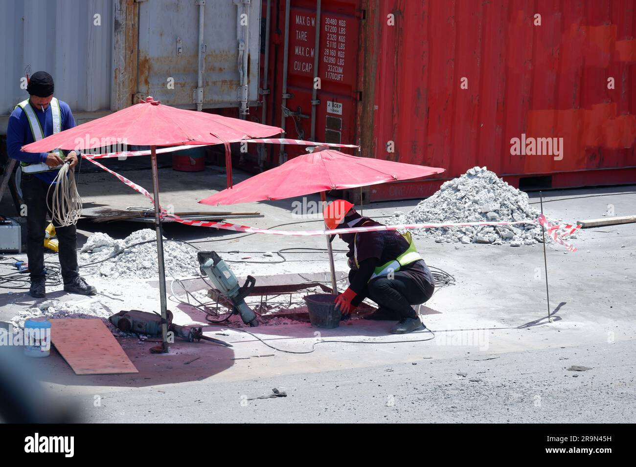 repairing the road construction corner Stock Photo - Alamy