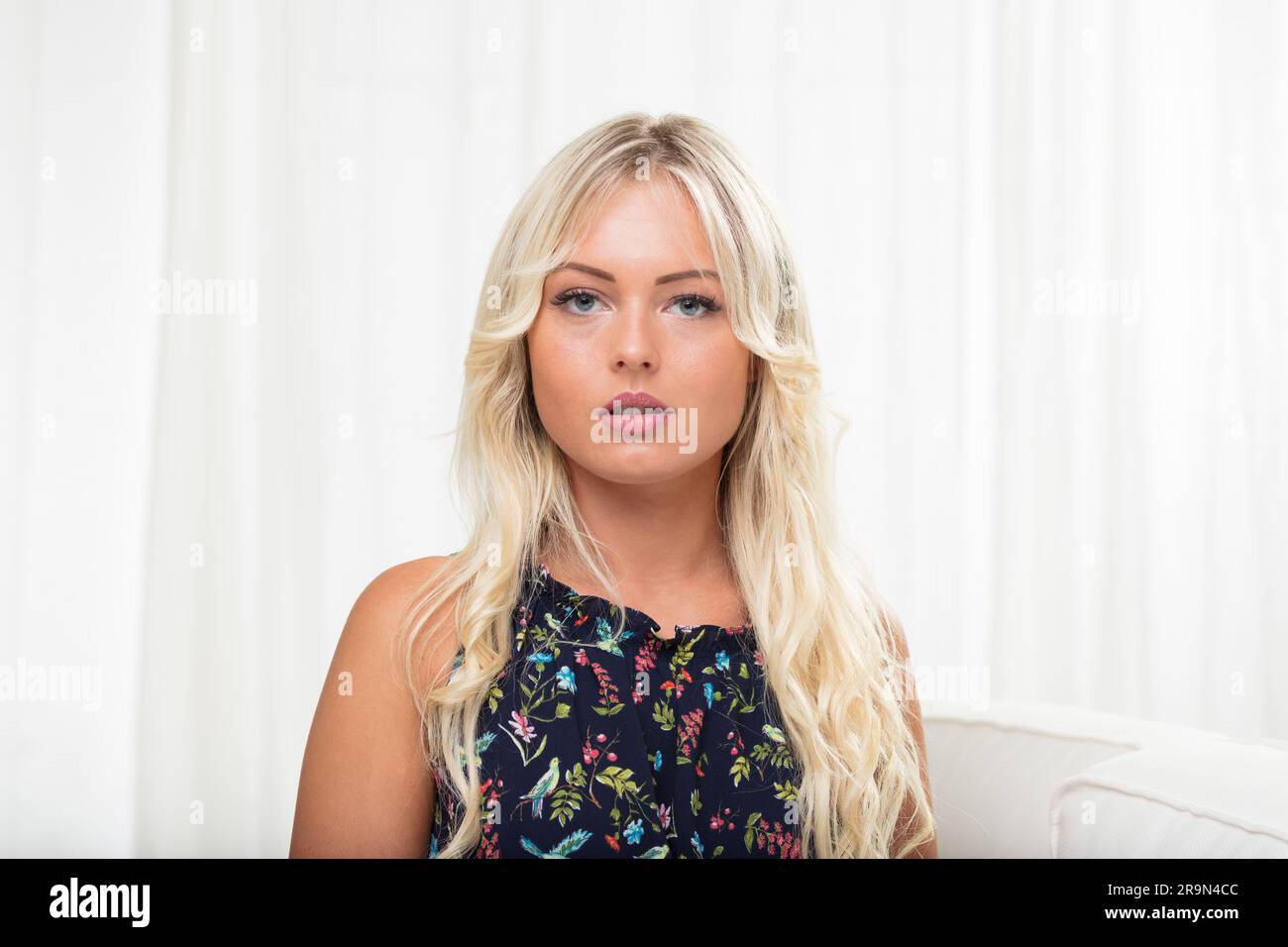 Portrait Of A Young Blonde Woman With A Slight Strabismus Of Venus Blue Eyes Long Straight