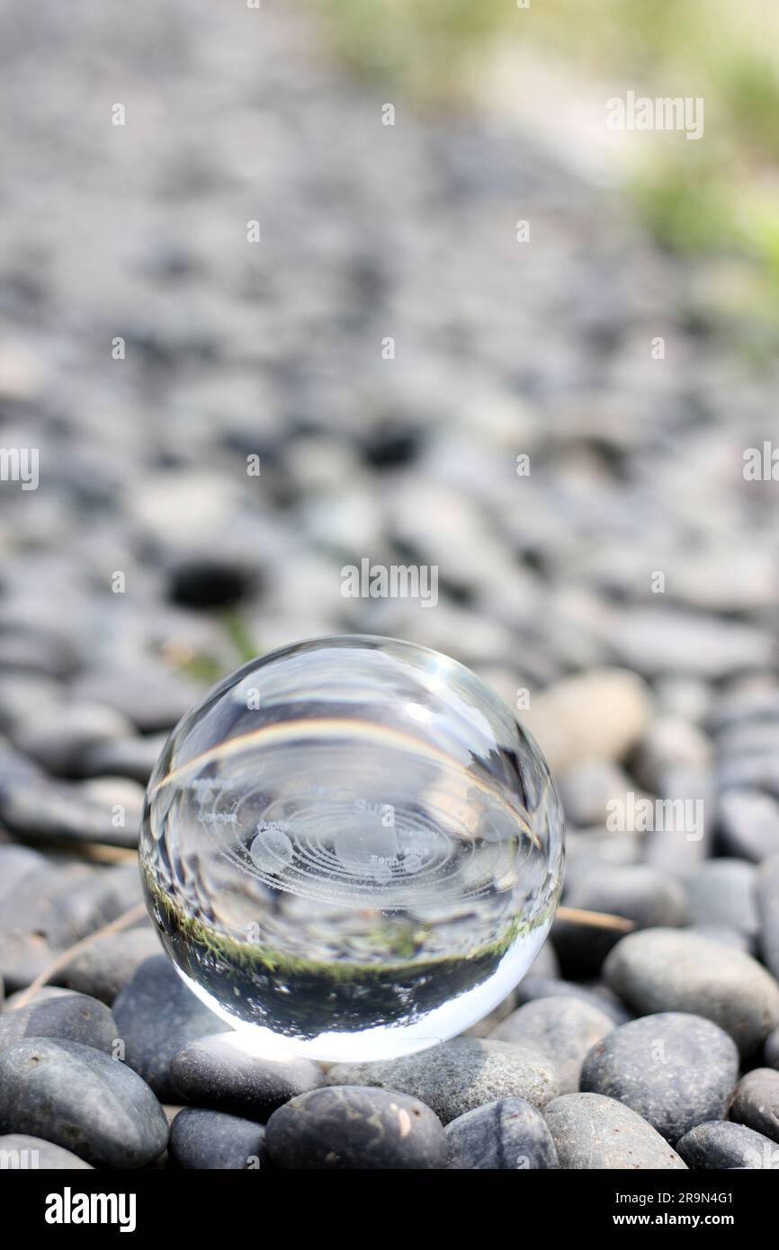 Nature photography of crystal ball with solar system in it, space ...