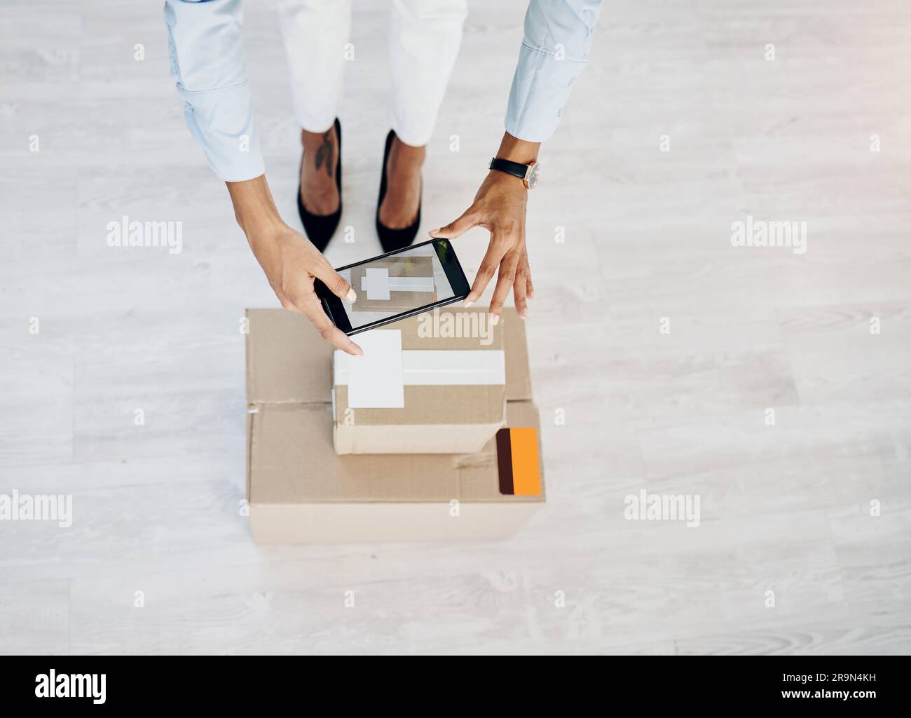 Delivery, phone and package with hands of woman and box for shipping ...