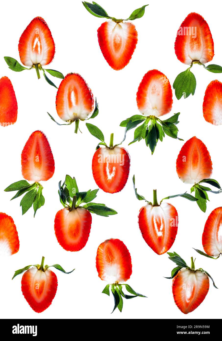 Strawberry slices on white background Stock Photo - Alamy