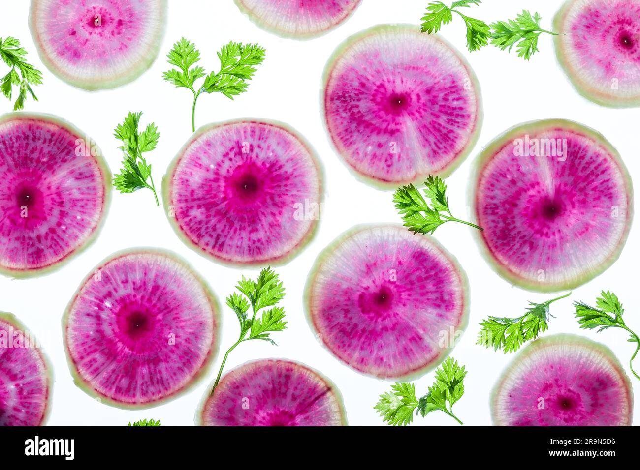 Thin slices of fresh vegetables on a white background Stock Photo - Alamy