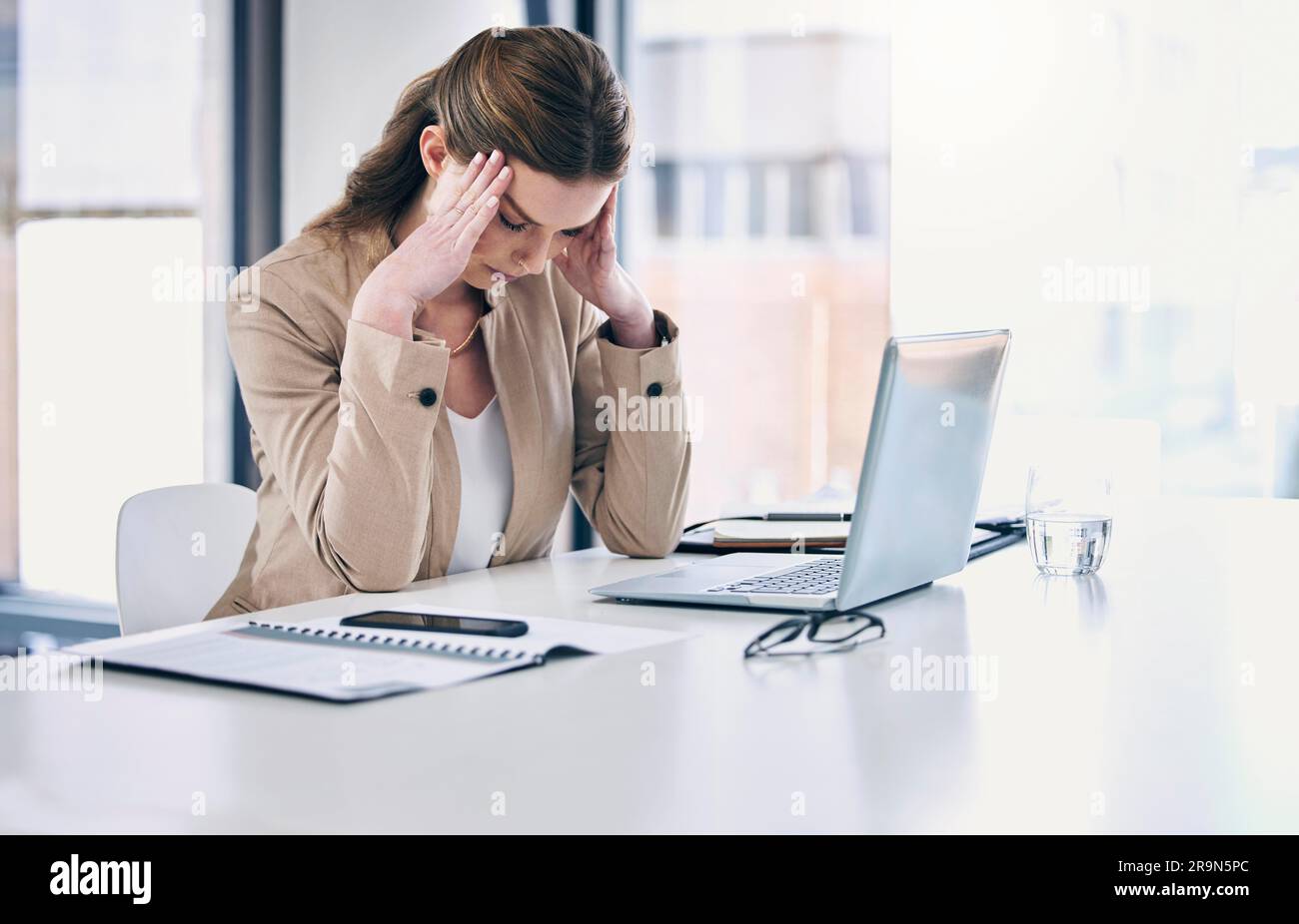 Headache, stress and woman in business, working at computer, desk with ...