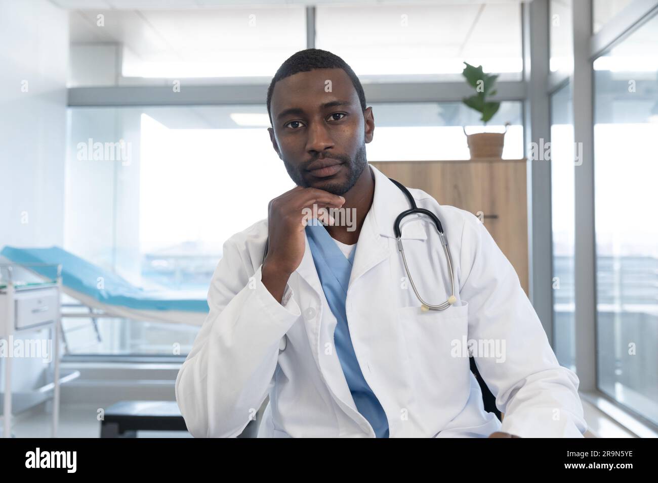 African american male doctor wearing lab coat and stethoscope, having ...