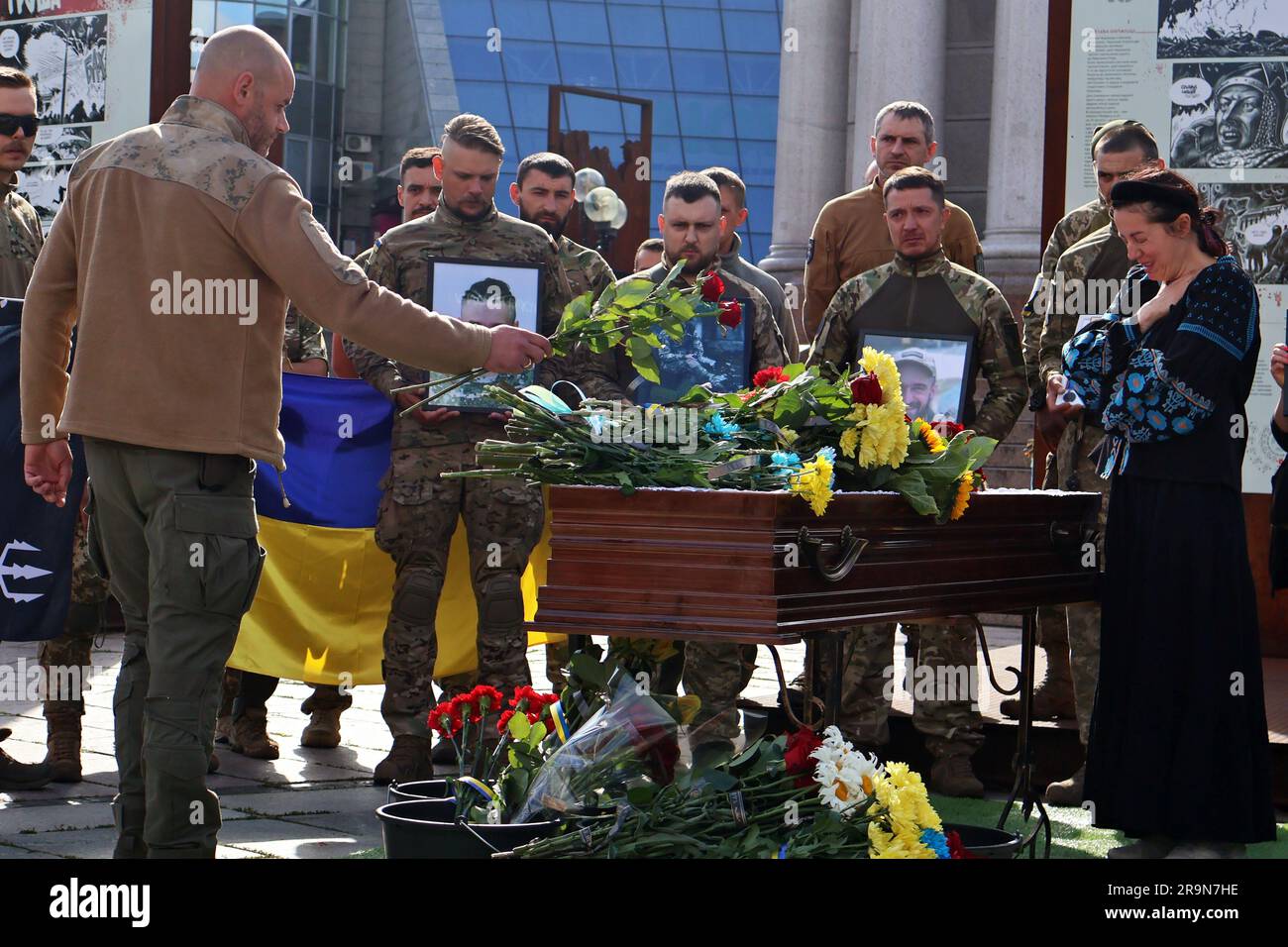 Kyiv, Ukraine. 28th June, 2023. Relatives and friends cry near the ...