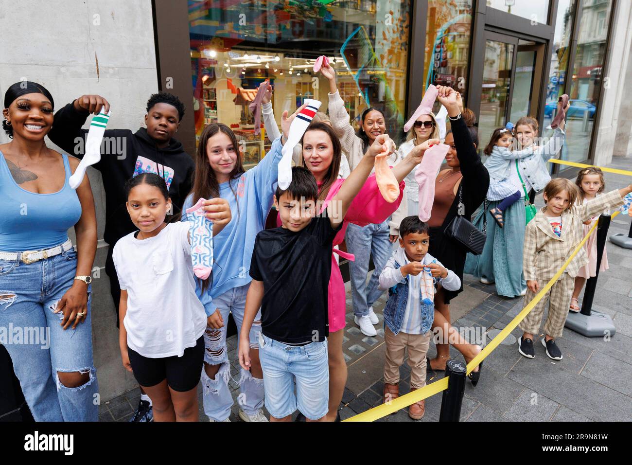 EDITORIAL USE ONLY Customers queue up to exchange a sock for a 'LEGO ...