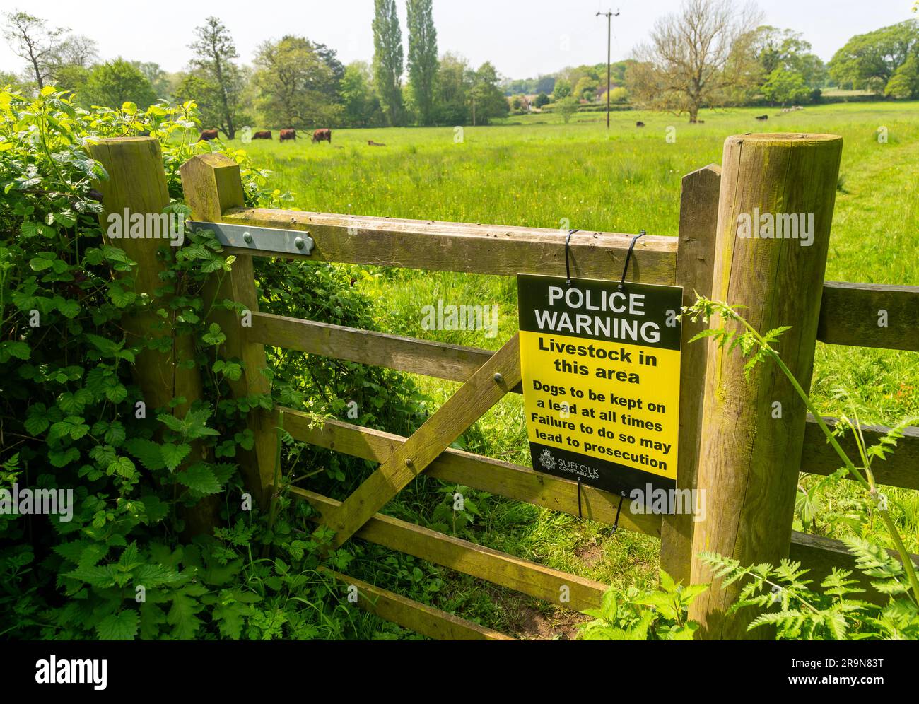 Police warning sign on gate about livestock in field, dogs to be kept ...