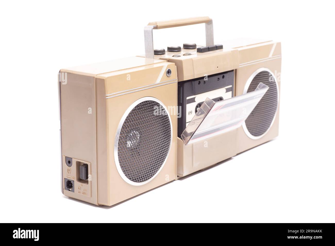 Retro portable stereo cassette recorder from 80s. with audio cassette tape. English translation ...