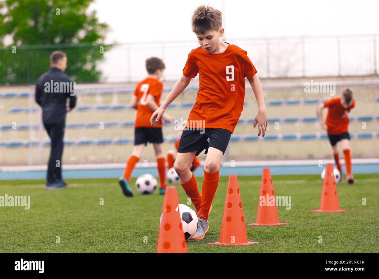 Happy Boy on Soccer Training Slalom Drill. Boys Practicing European ...