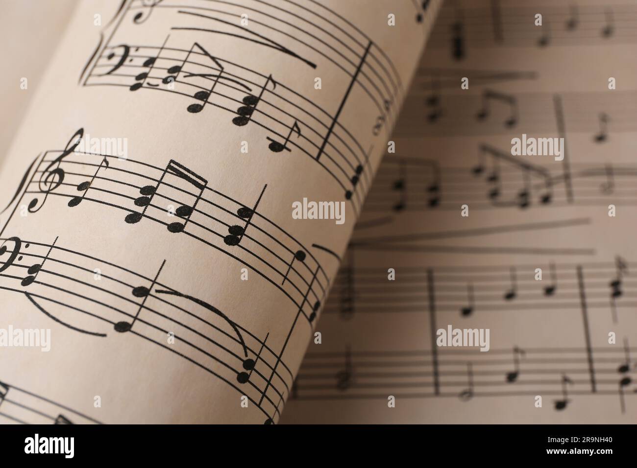 Closeup view of sheets with music notes Stock Photo - Alamy