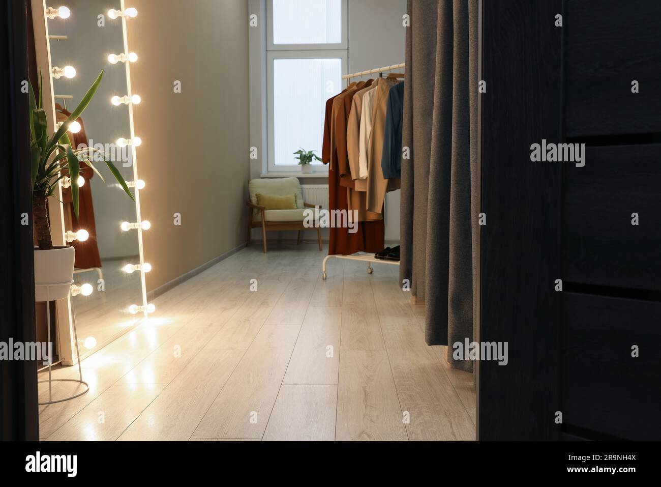 Dressing room with clothes rack and mirror. Interior design Stock Photo ...