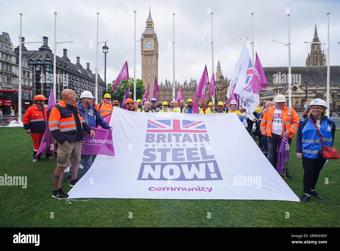 London UK. 28 June 2023 Steelworkers unfurl a banner in Parliament ...