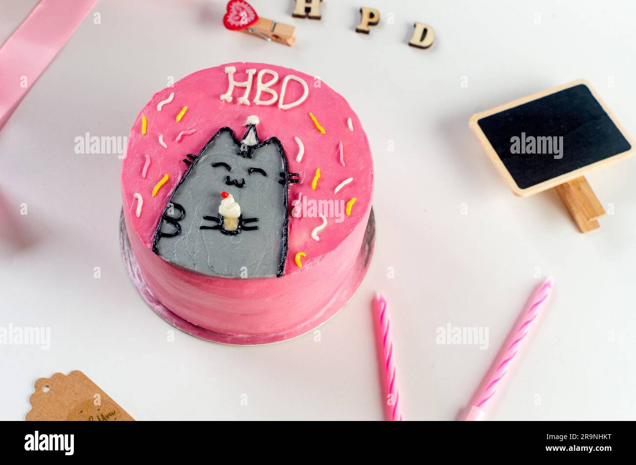 Trendy bento cake pink color with cute decor on light background. Cake ...