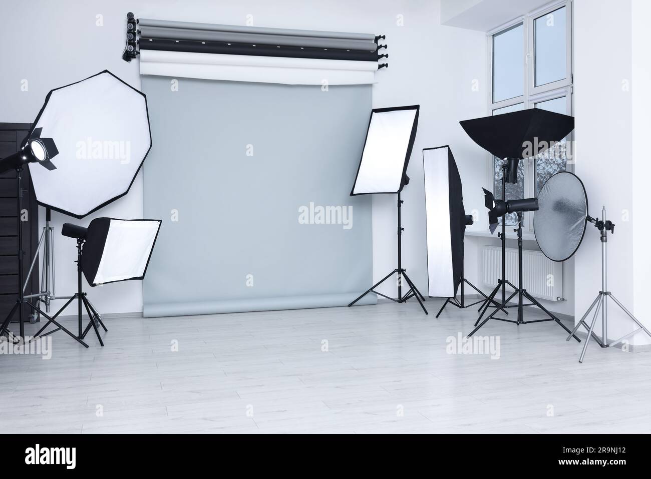 Interior of modern photo studio with professional lighting equipment ...
