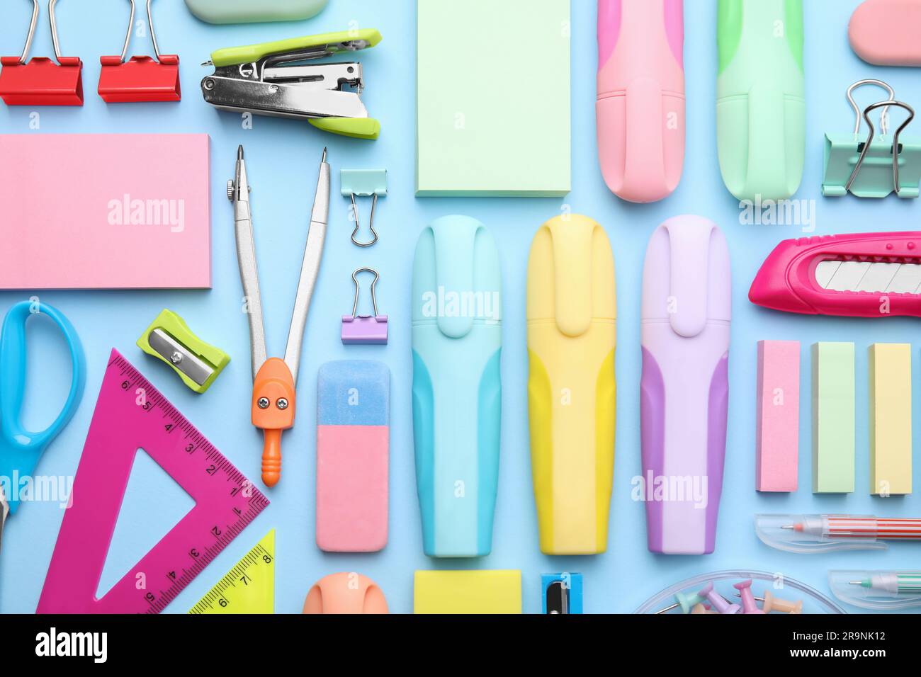 Many different school stationery on light blue background, flat lay ...