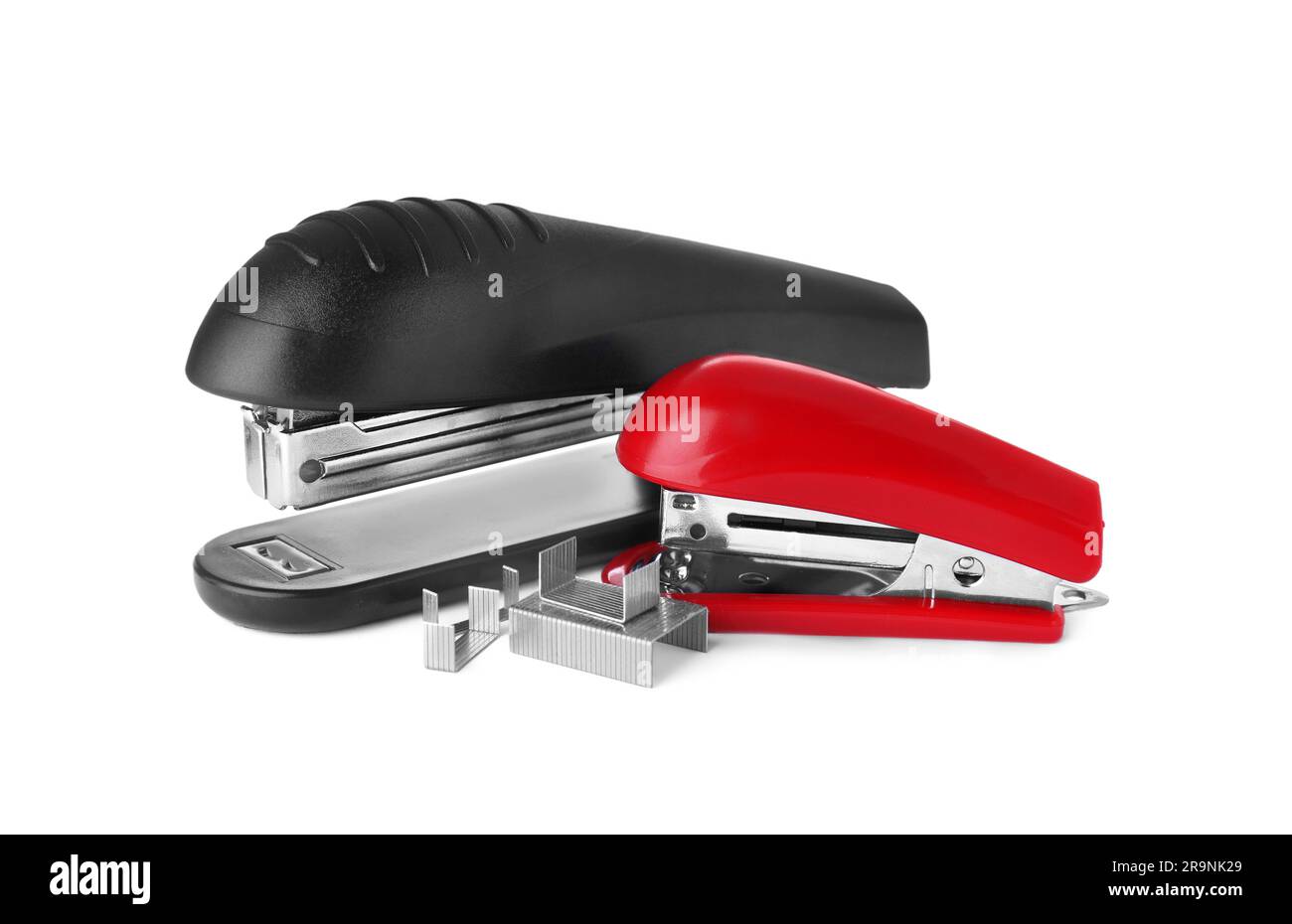 Bright color staplers with staples isolated on white Stock Photo - Alamy