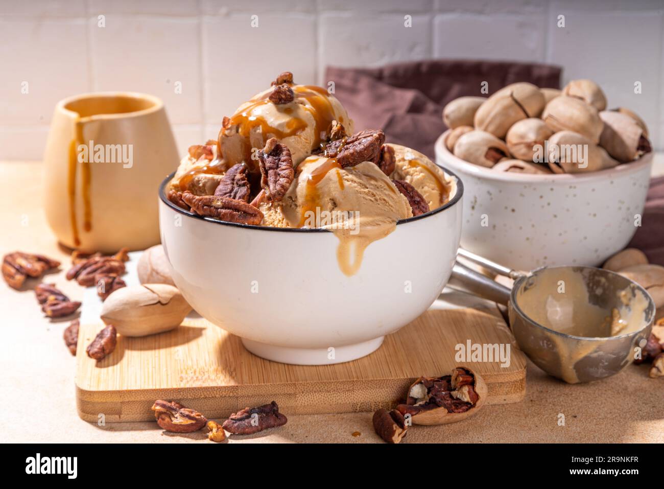 Pecan pie ice cream bowl. Traditional autumn spicy pecan caramel pie ...