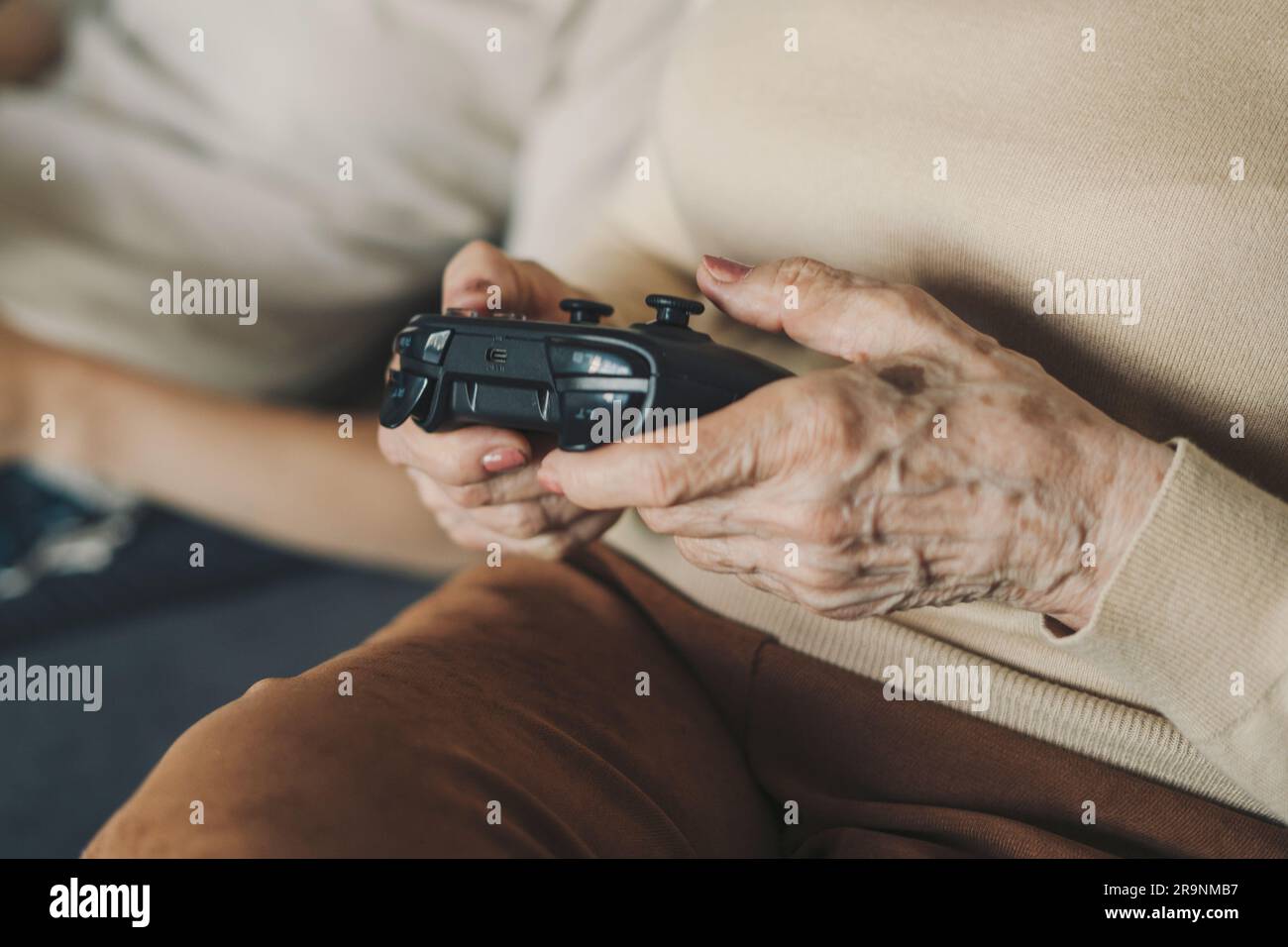 Crop man playing video games on smartphone Stock Photo - Alamy