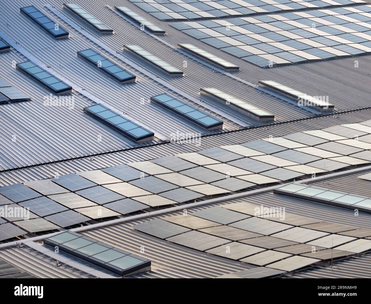 Looking down from a moored cruise ship onto the curved roof of the ...