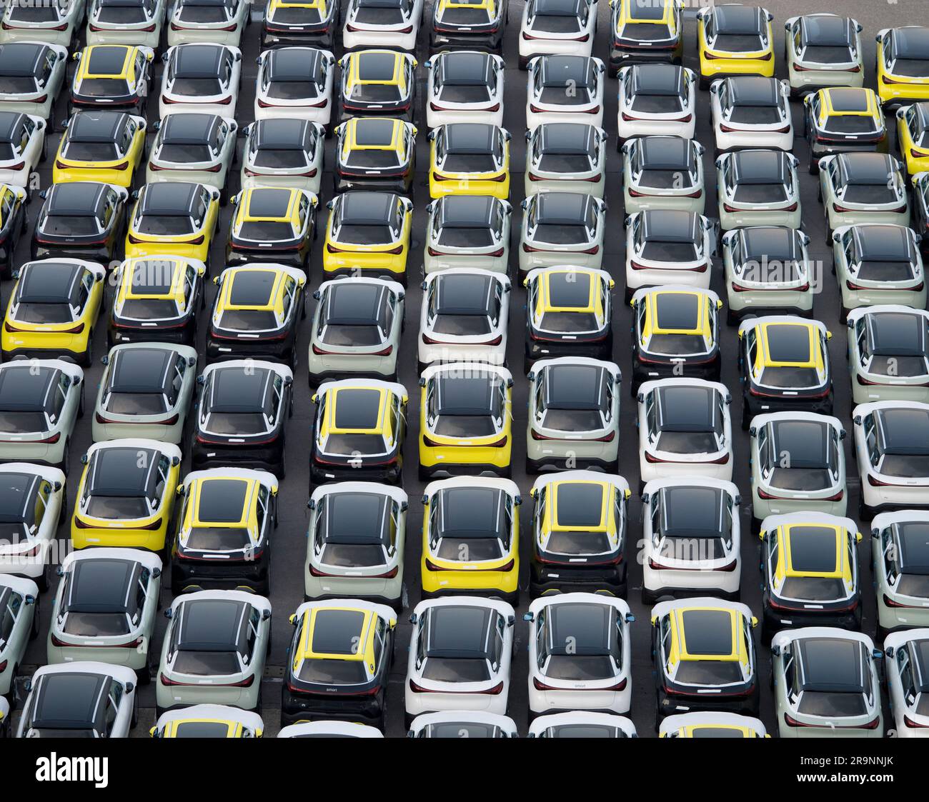 Pure geometry - endless rows of newly imported cars arrayed onshore in ...