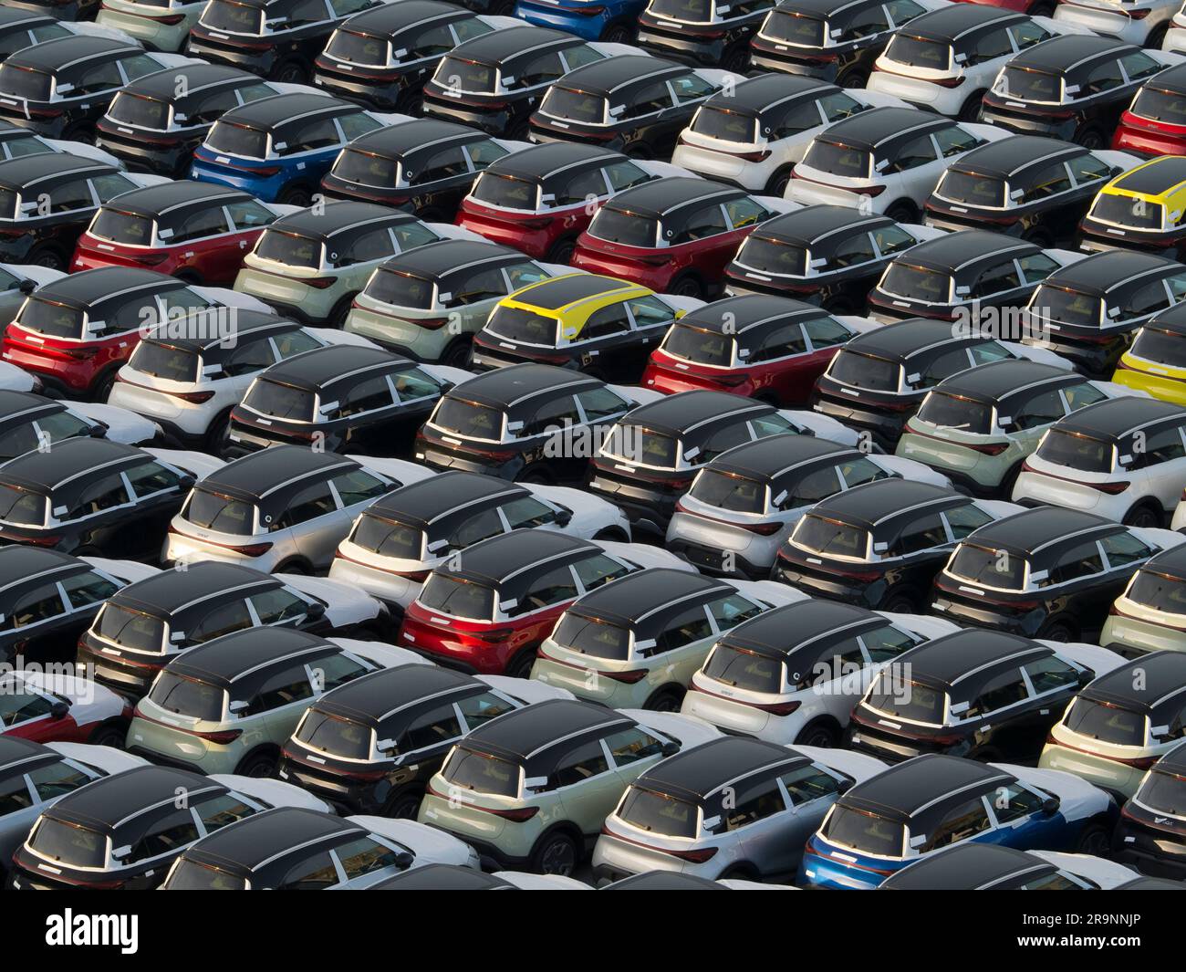 Pure geometry - endless rows of newly imported cars arrayed onshore in ...