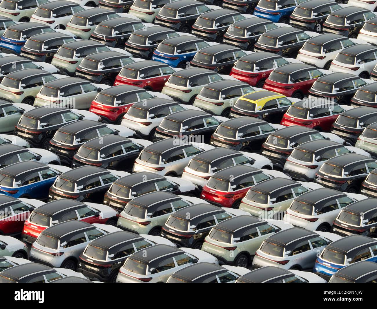 Pure geometry - endless rows of newly imported cars arrayed onshore in ...