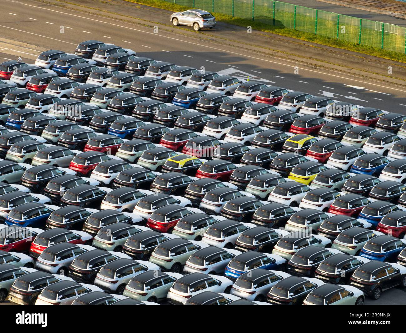Pure geometry - endless rows of newly imported cars arrayed onshore in ...