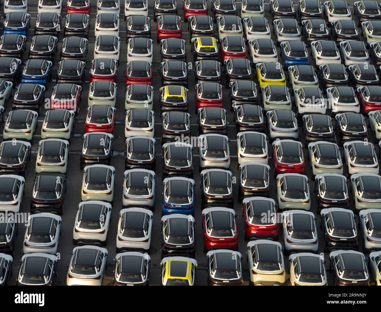 Pure geometry - endless rows of newly imported cars arrayed onshore in ...