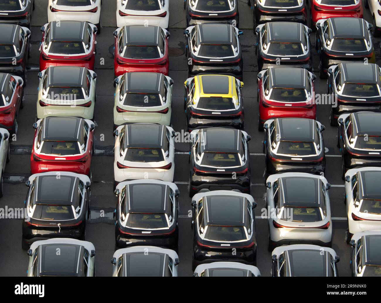 Pure geometry - endless rows of newly imported cars arrayed onshore in ...