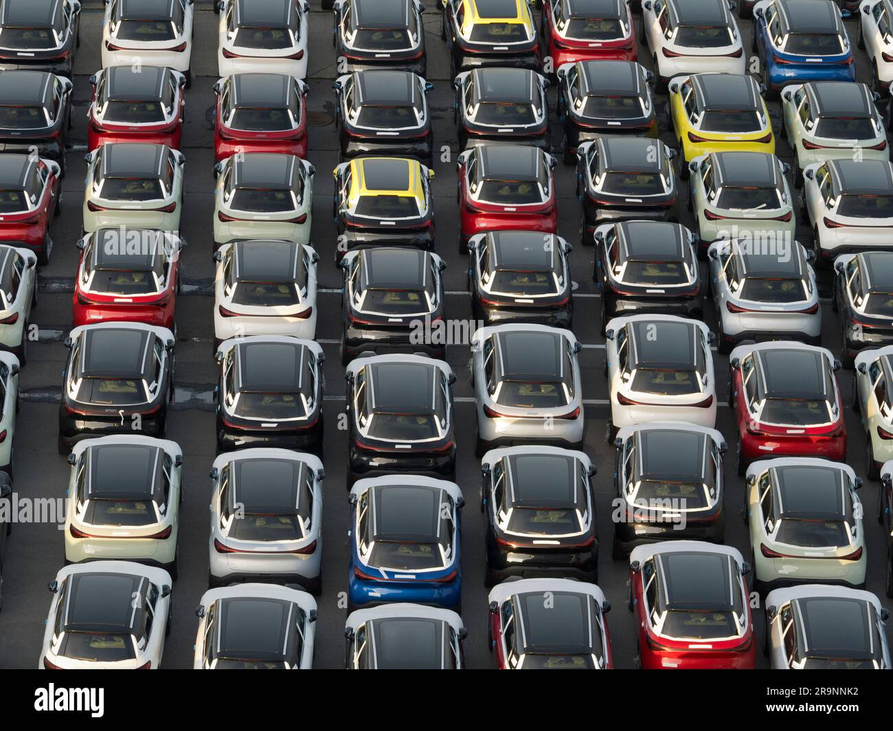 Pure geometry - endless rows of newly imported cars arrayed onshore in ...
