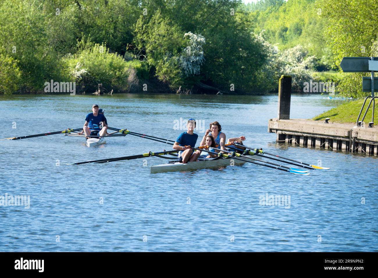 Rowing teams on the Thames at Sandford Village, just by Sandford Lock and downstream of Oxford ...