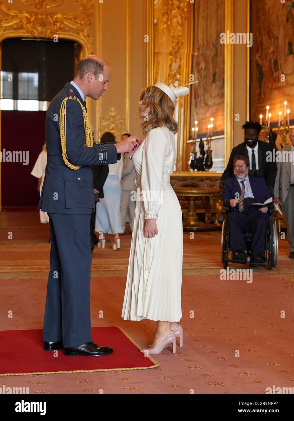 Kate Garraway, from London, is watched by her husband Derek Draper as ...