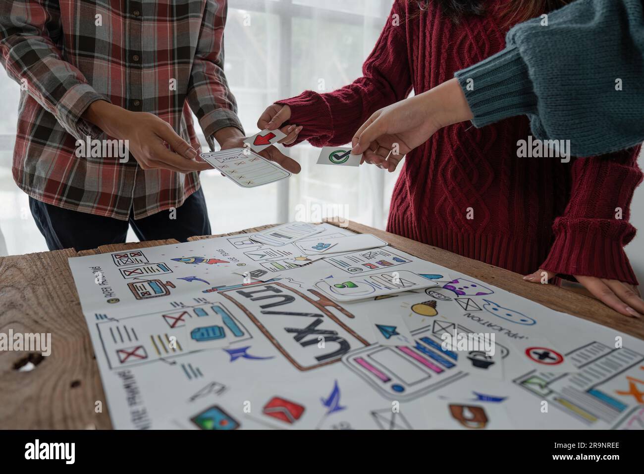 Ux Developer And Ui Designer Brainstorming About Mobile App Interface