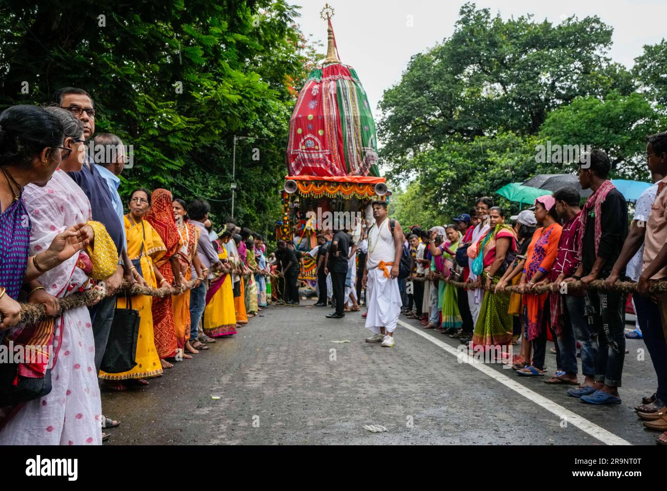 Hindu devotees pull a chariot during the Rath Yatra, or chariot ...