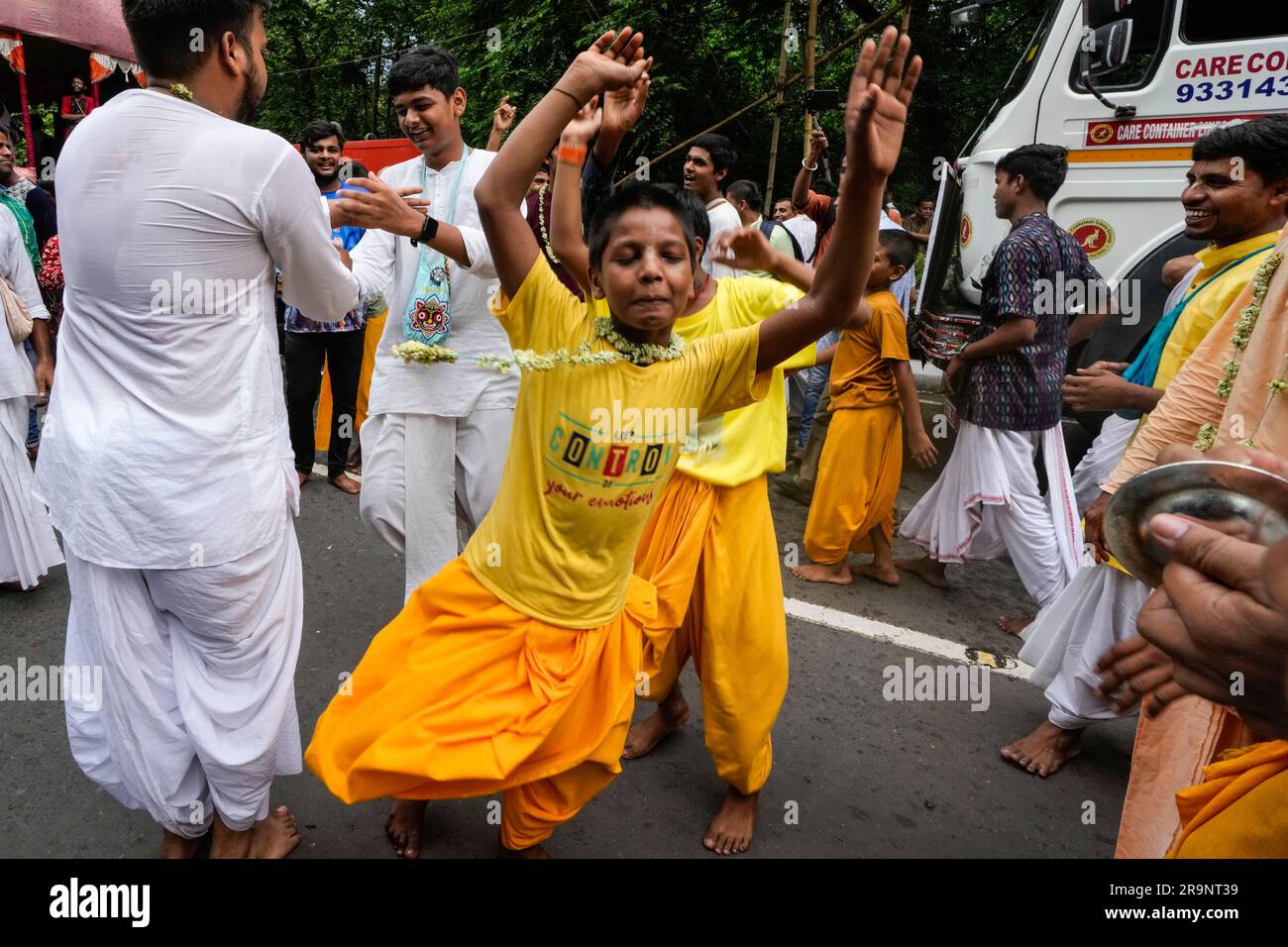 Devotees dance during the Rath Yatra, or chariot festival, carrying the ...