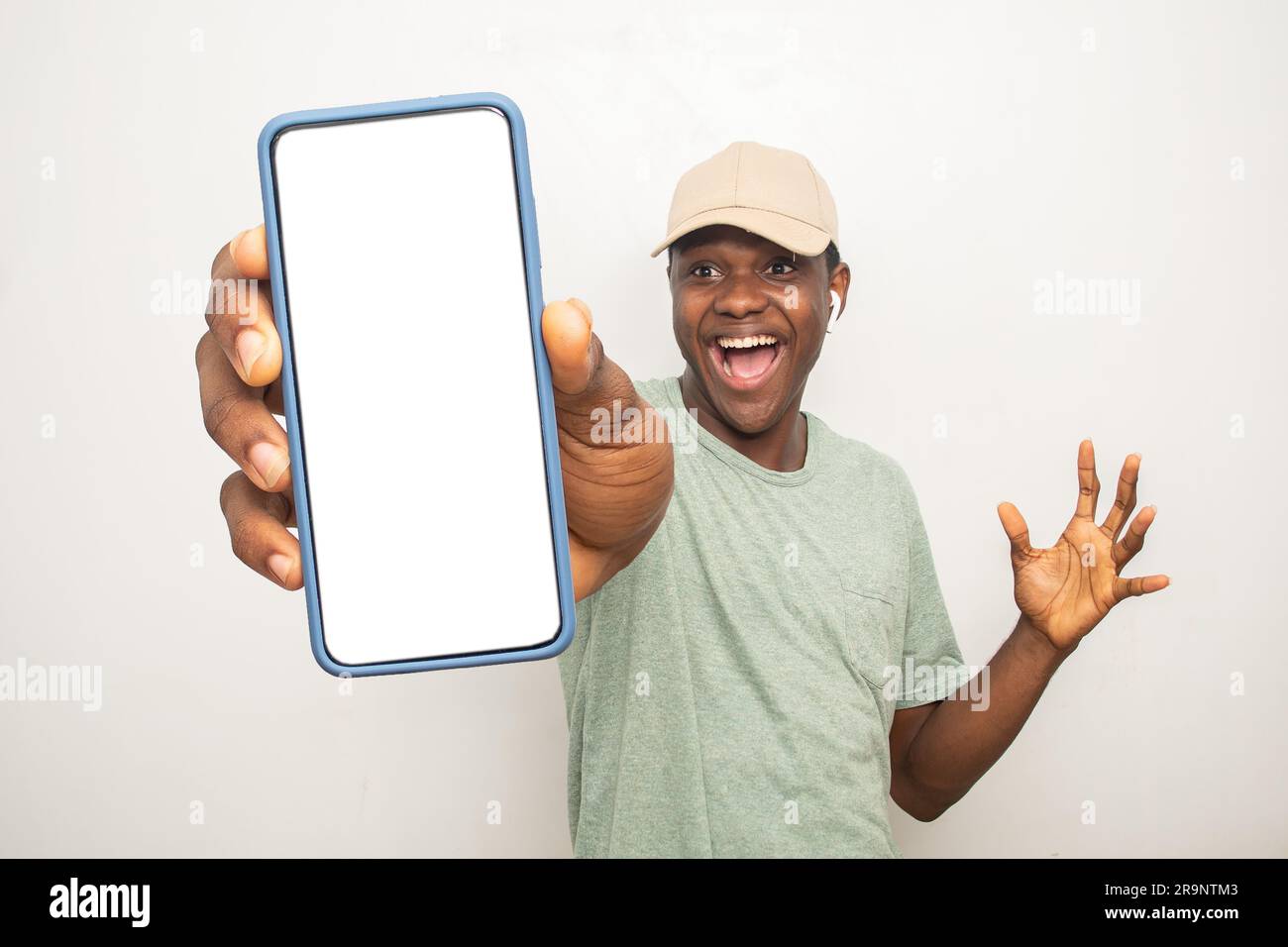 Man excitedly showing smartphone hi-res stock photography and images ...